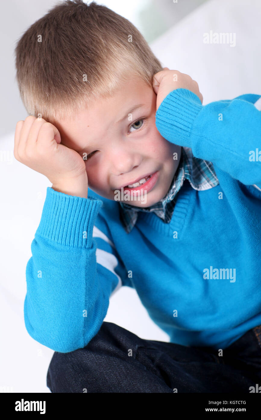 Portrait of shy little boy Stock Photo - Alamy