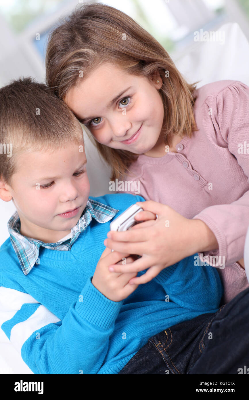Children playing with smartphone Stock Photo - Alamy