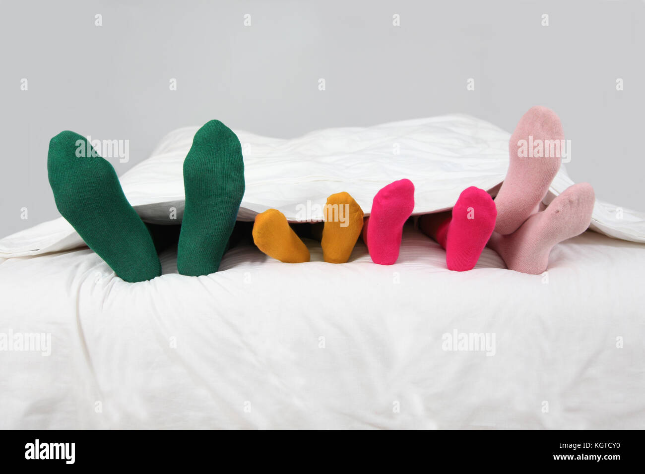 Feet family in bed hi-res stock photography and images - Alamy