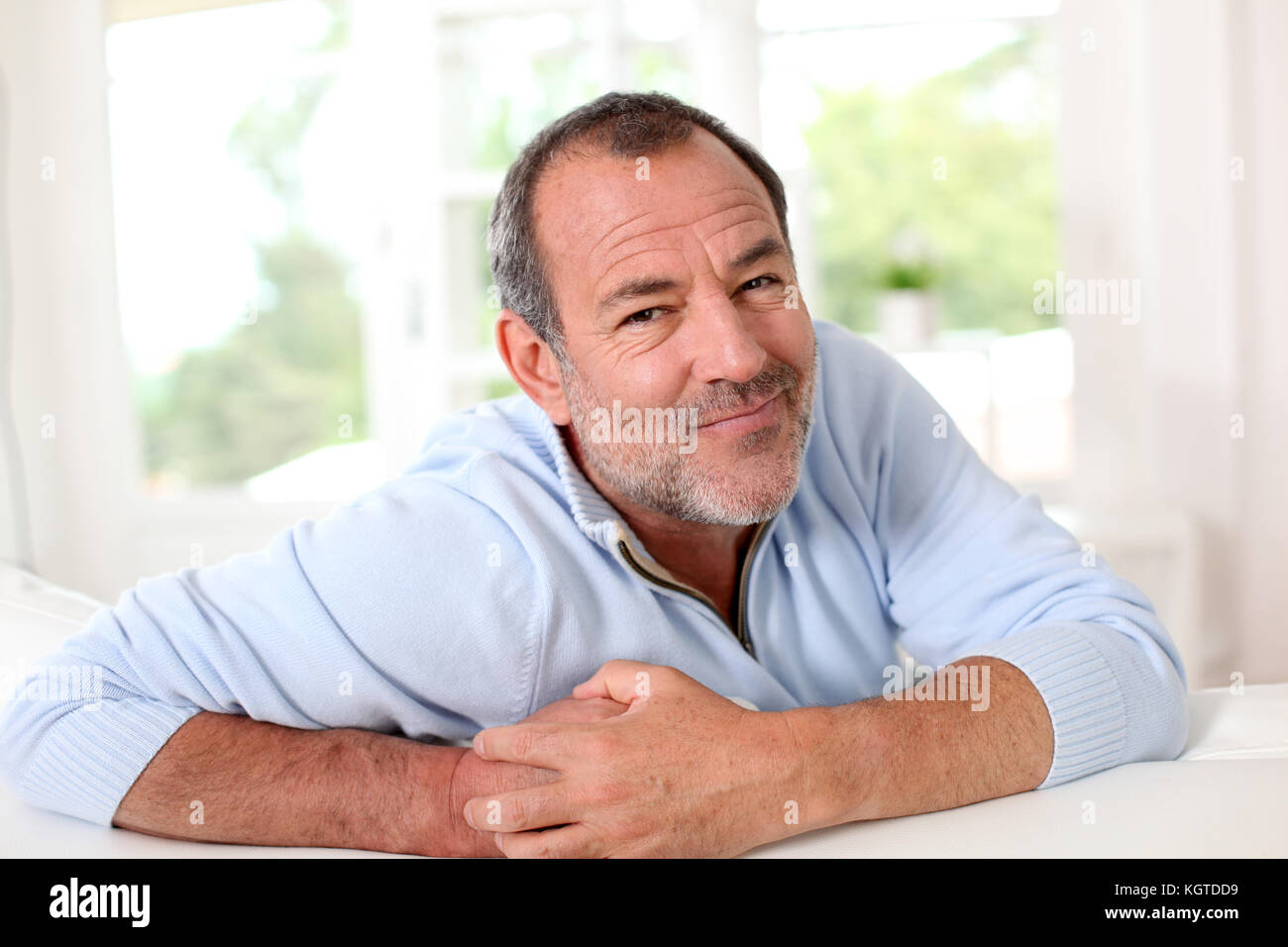 Senior man with doubtful look on his face Stock Photo - Alamy