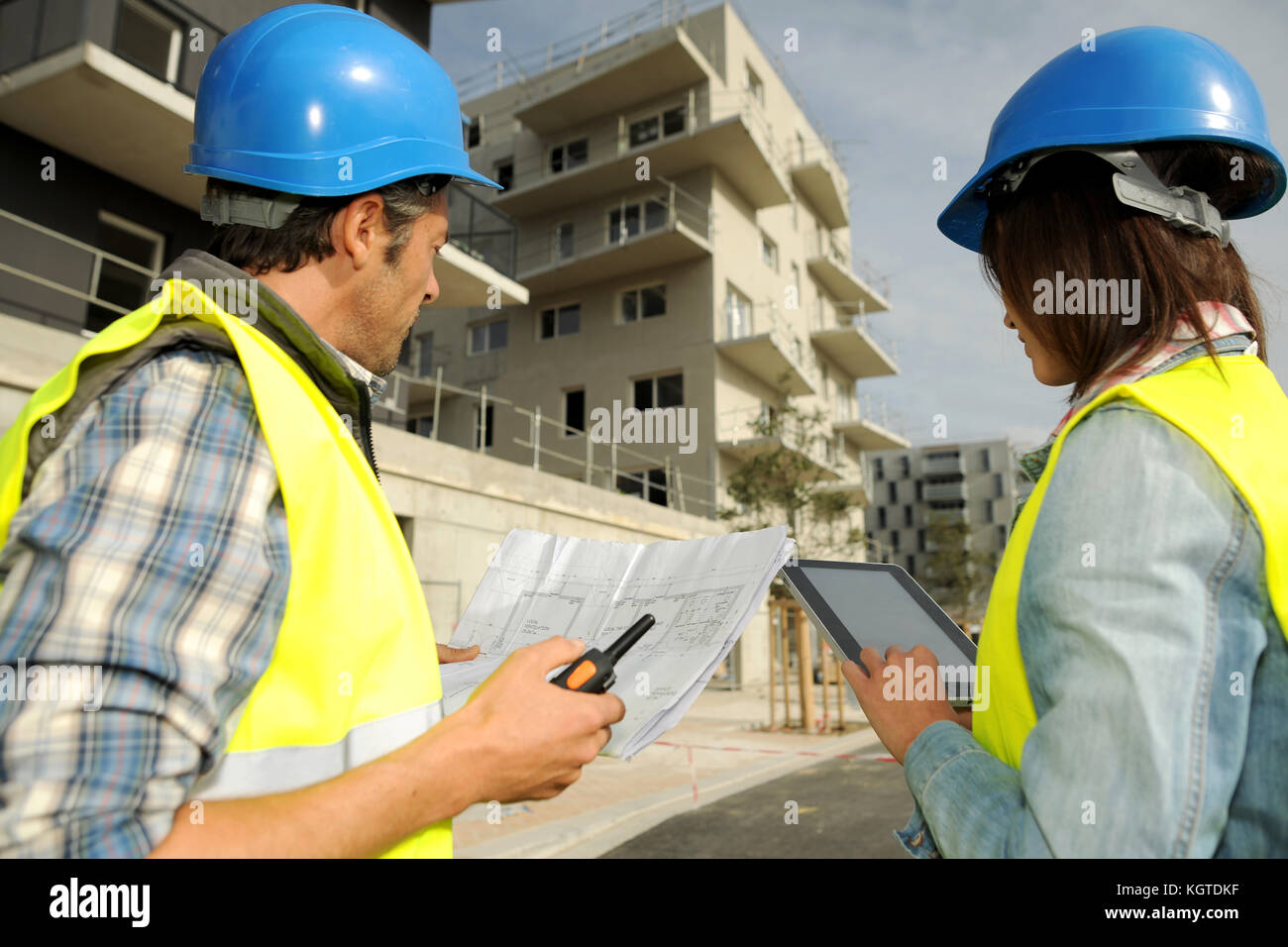 Engineers working on construction site Stock Photo - Alamy