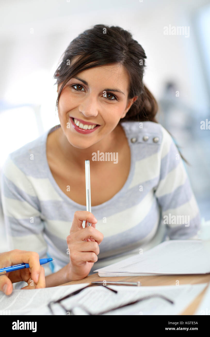 Young woman in class preparing exam Stock Photo - Alamy
