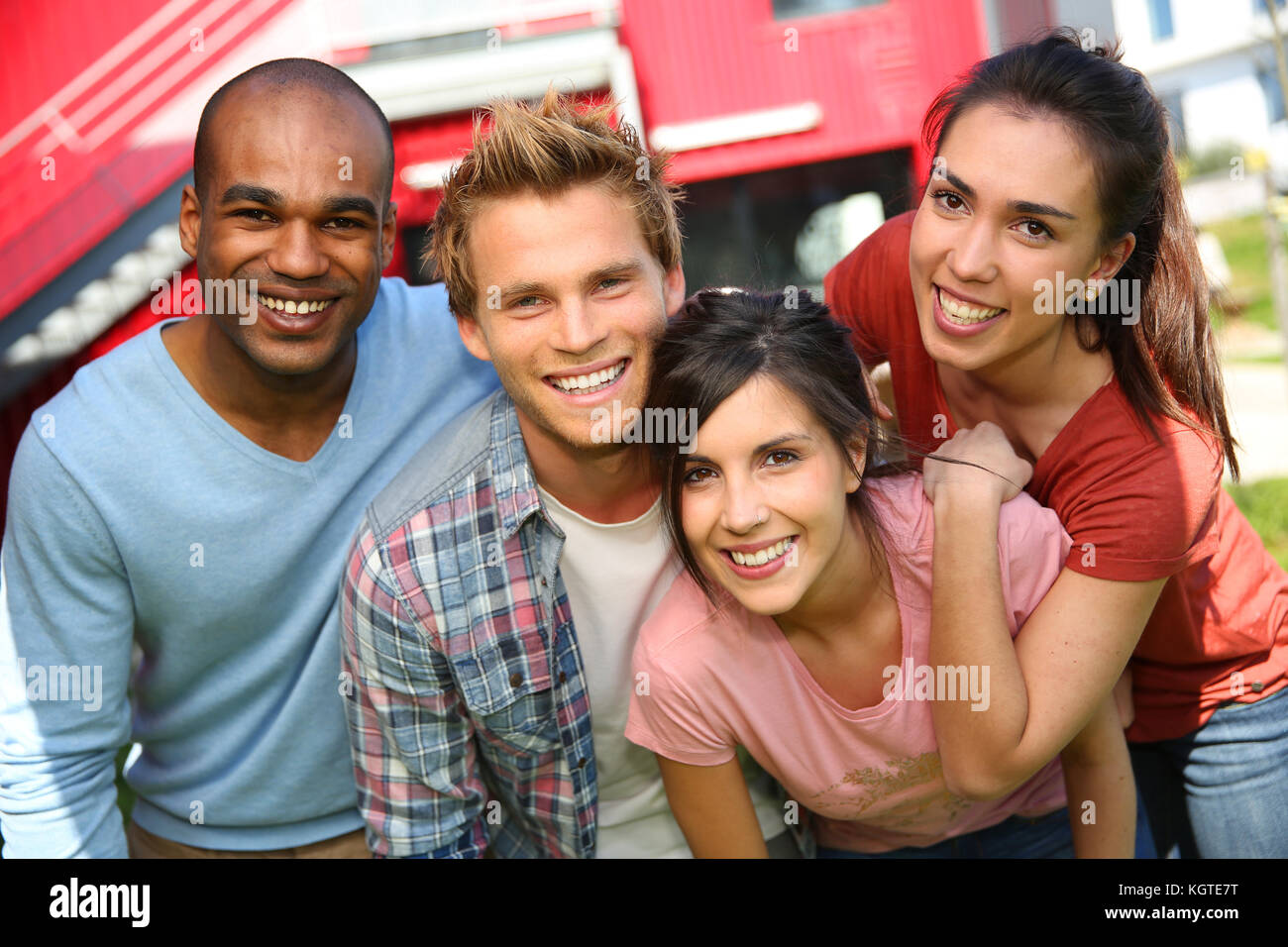 Group of students having fun outside college campus Stock Photo - Alamy
