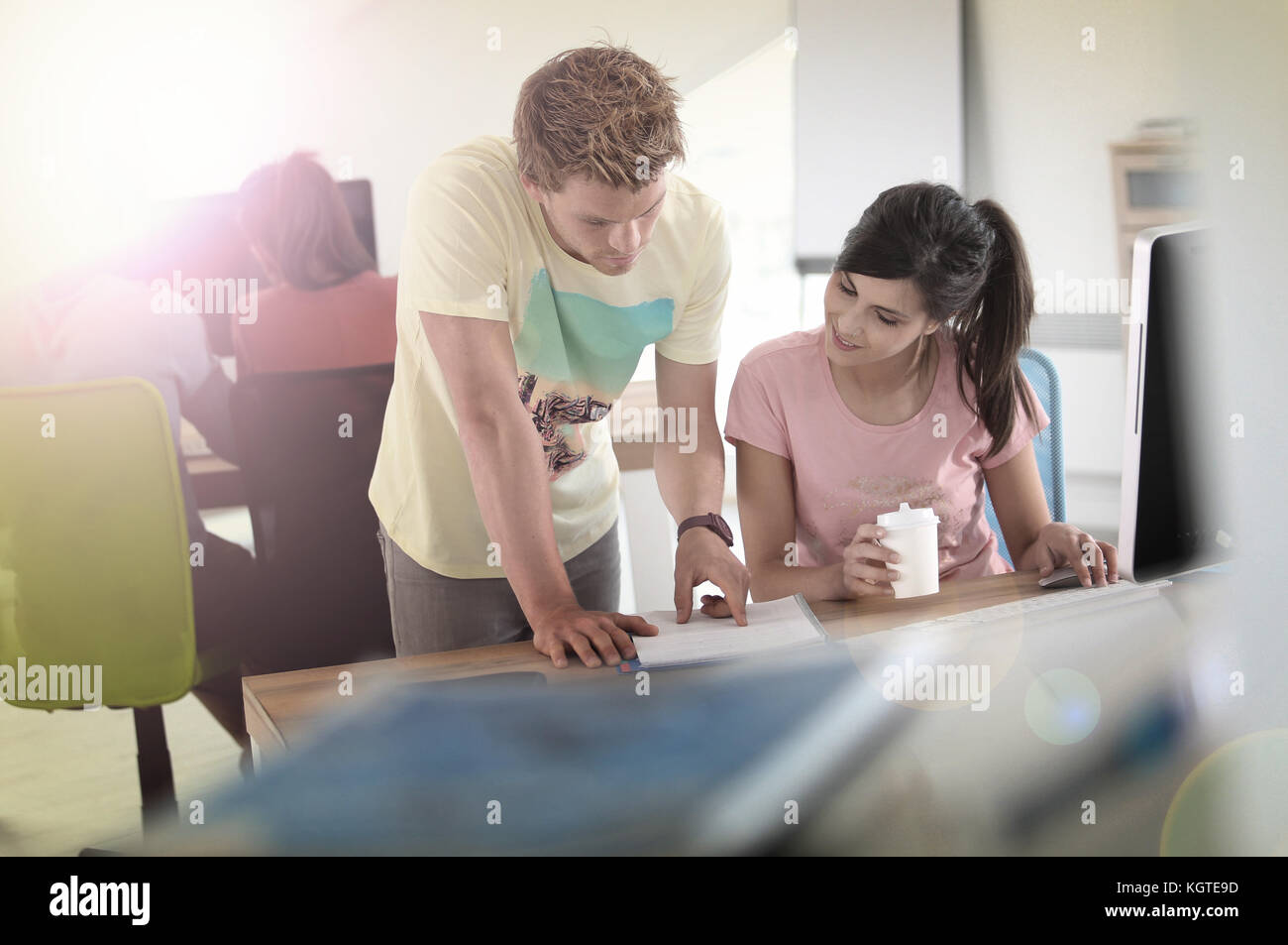 Young people in business class working on desktop Stock Photo - Alamy