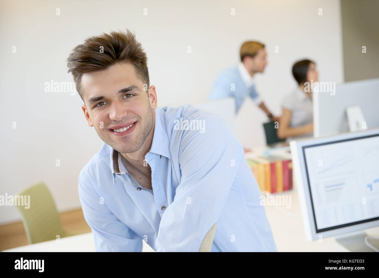 Portrait of smiling office worker Stock Photo - Alamy