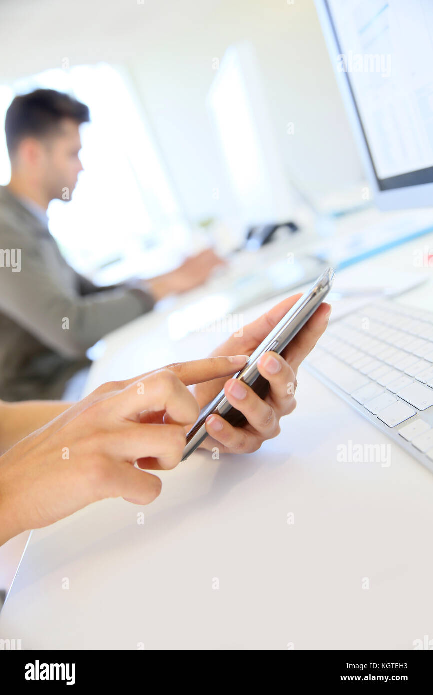 Closeup of hands sliding on smartphone screen Stock Photo - Alamy