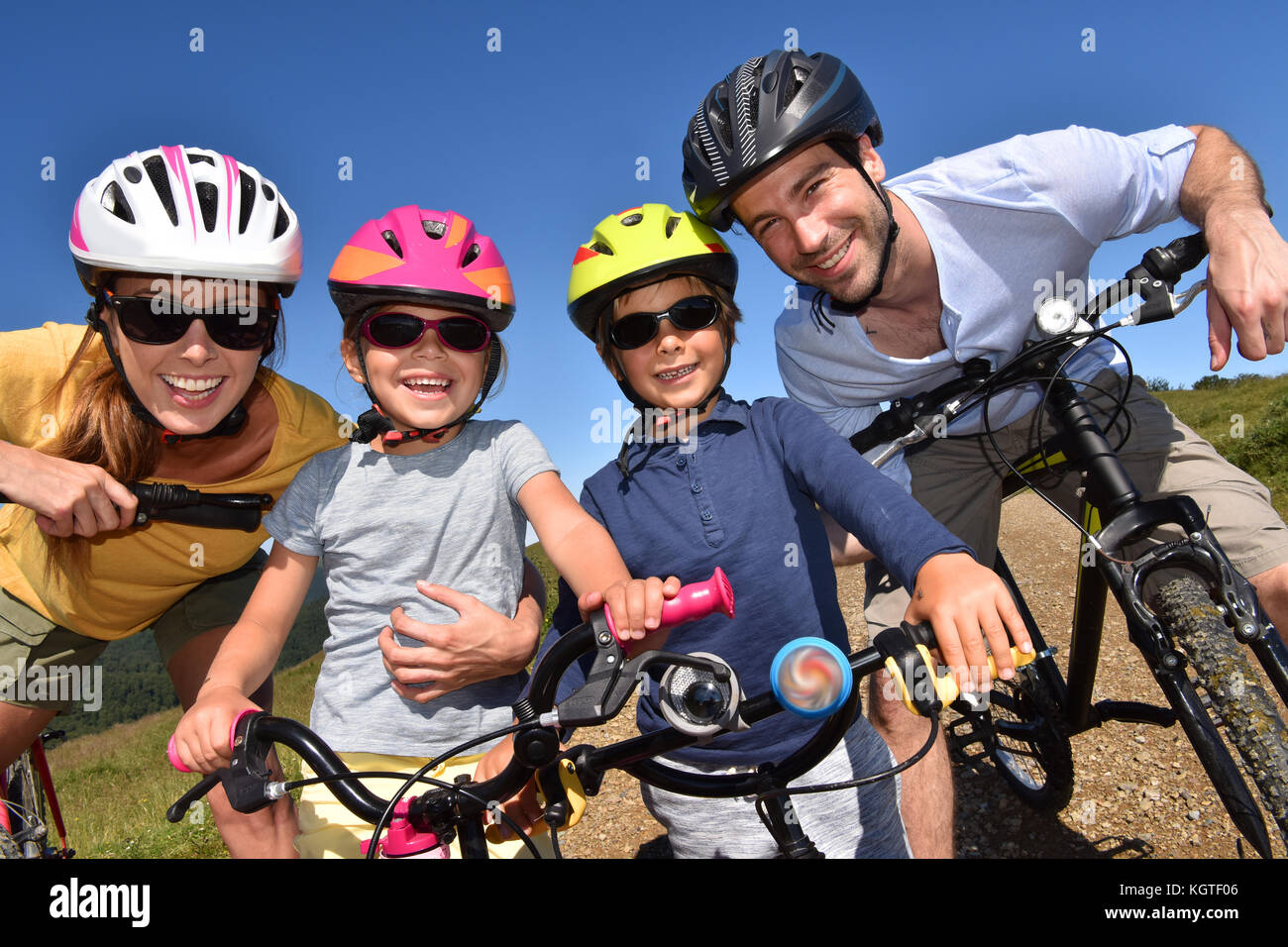 Portrait of happy family on a biking day Stock Photo - Alamy