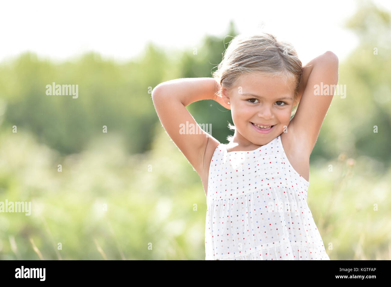 Portrait of cute little blond girl in countryside, summertime Stock ...