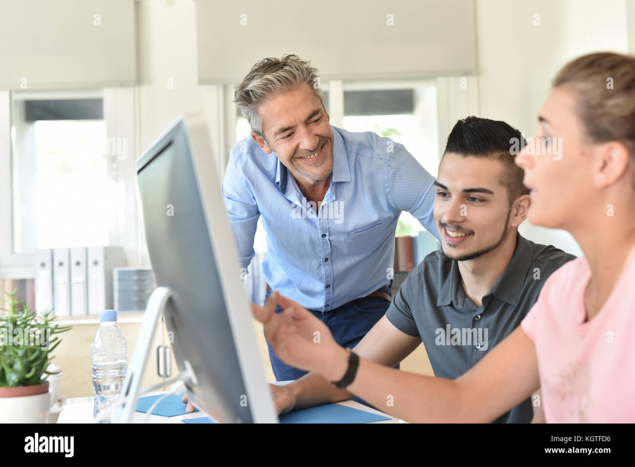 Students in business class with trainer Stock Photo - Alamy