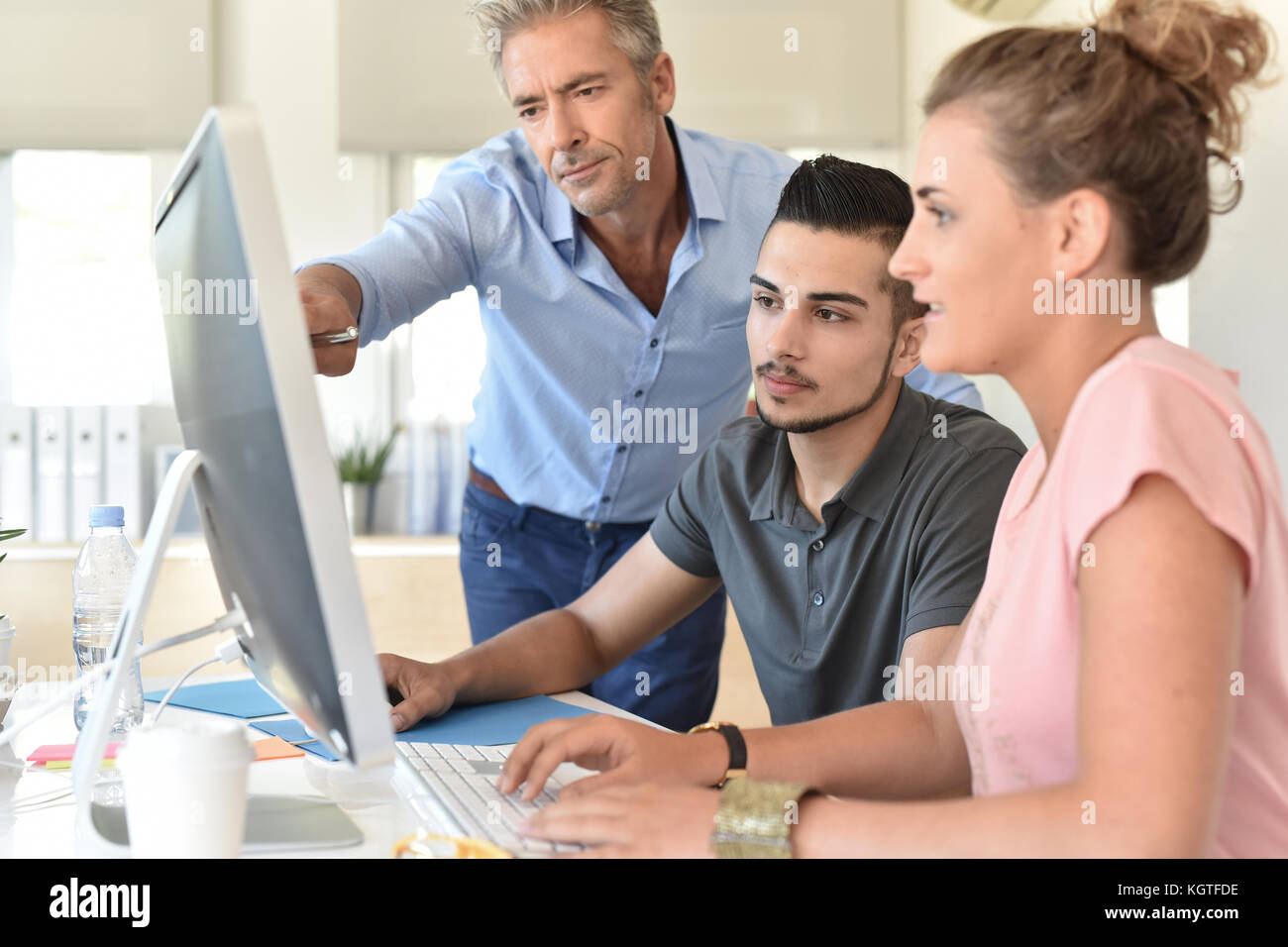 Students in business class with trainer Stock Photo - Alamy