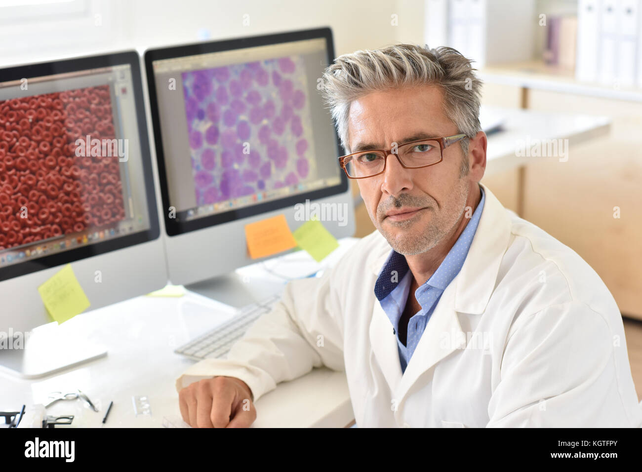 Portrait of microbiology scientist in office Stock Photo - Alamy