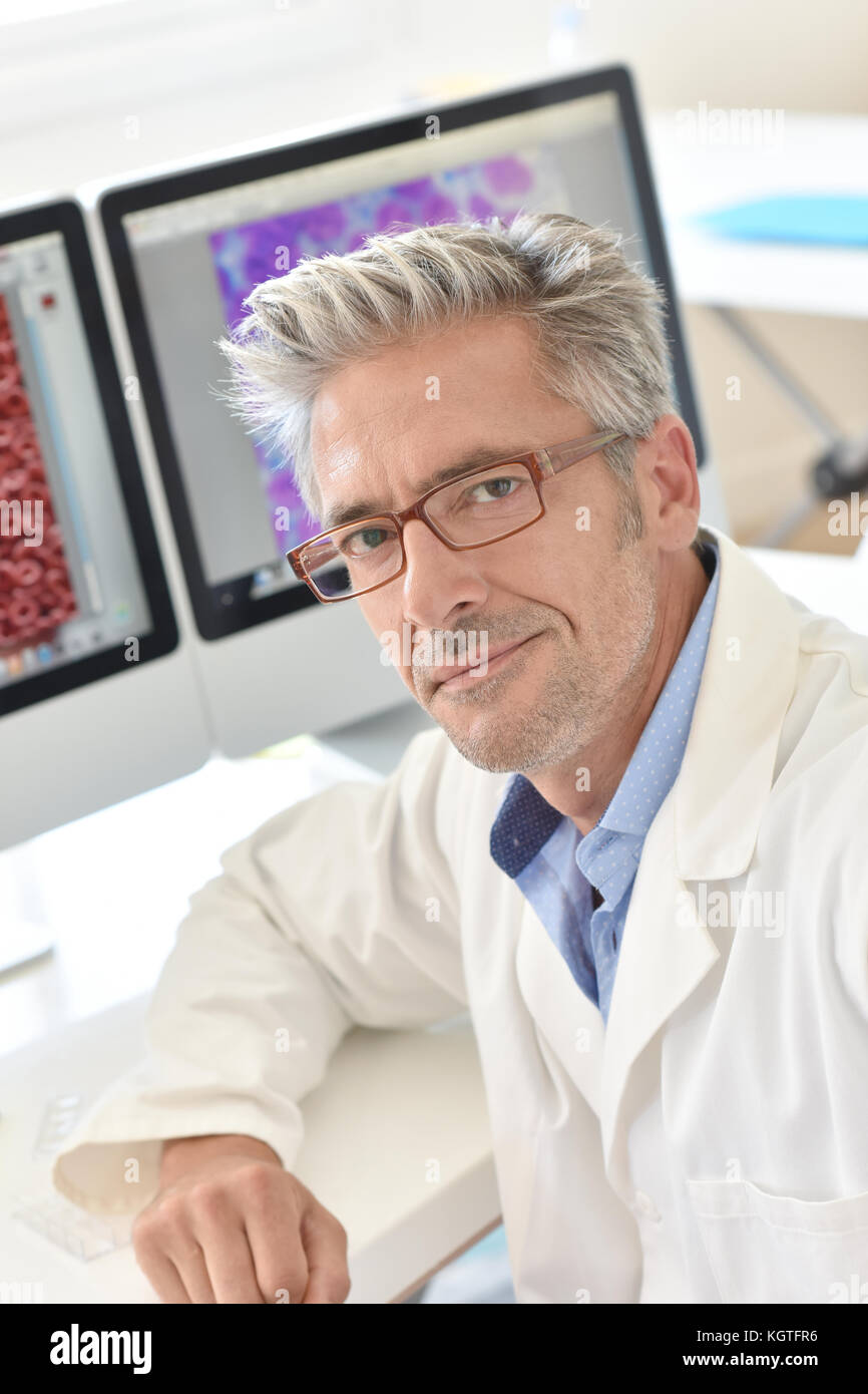 Portrait of microbiology scientist in office Stock Photo - Alamy