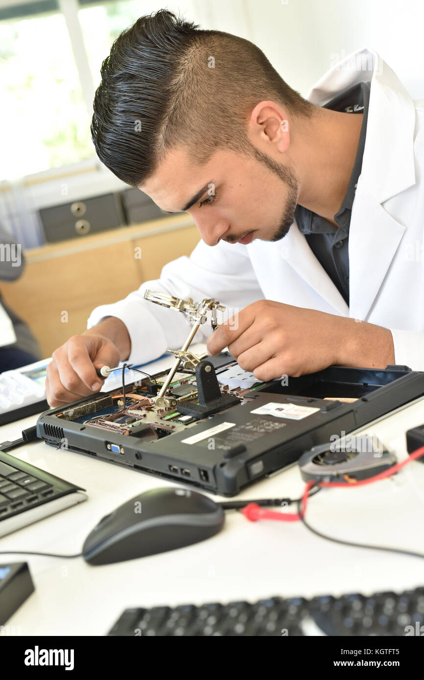 Student in technology fixing computer processing Stock Photo - Alamy