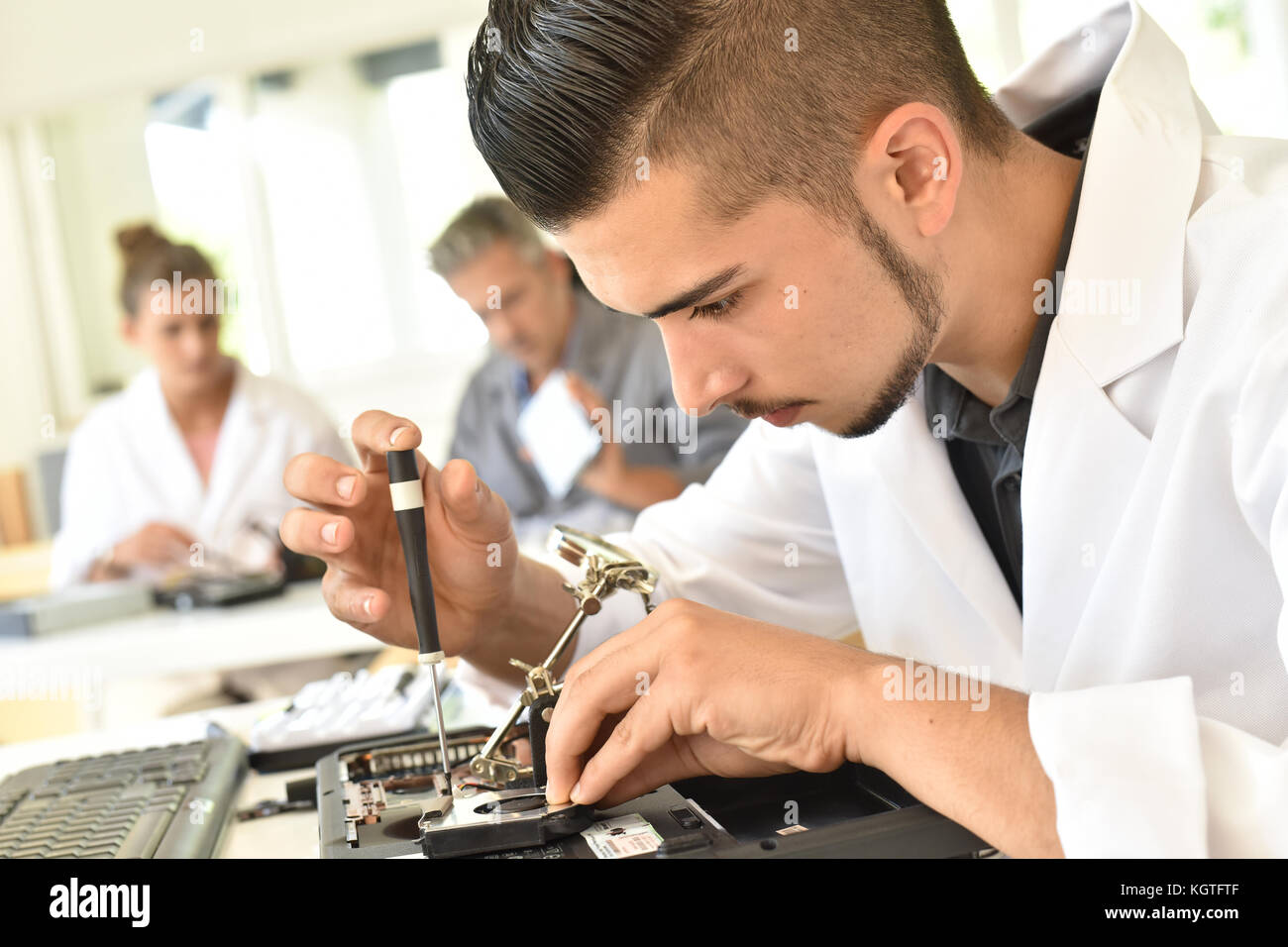 Student in technology fixing computer processing Stock Photo - Alamy