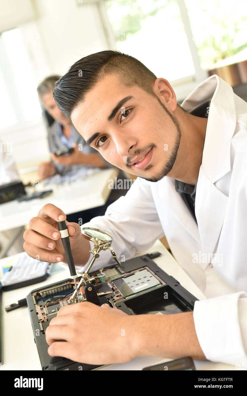 Student in technology fixing computer processing Stock Photo - Alamy