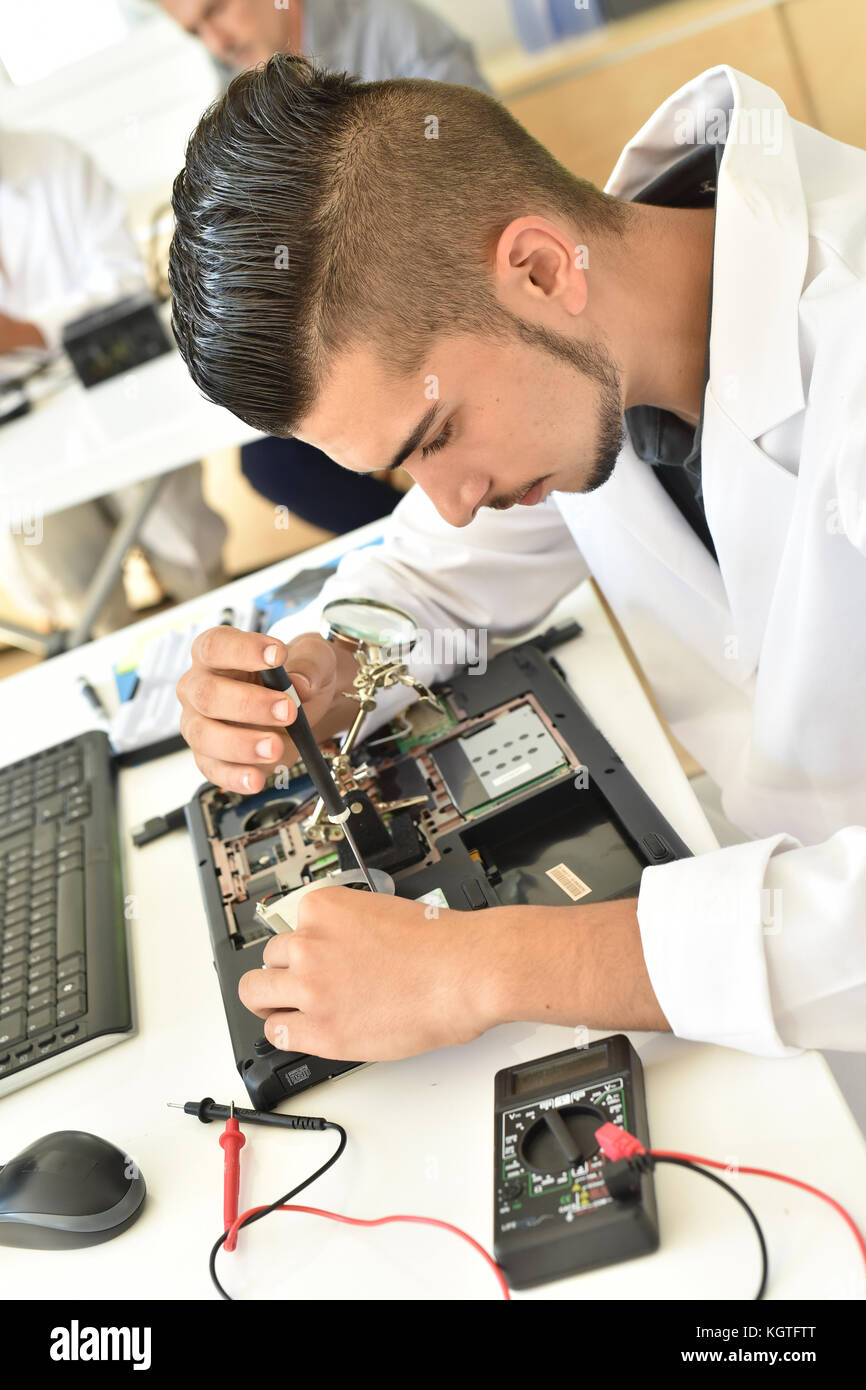 Student in technology fixing computer processing Stock Photo - Alamy