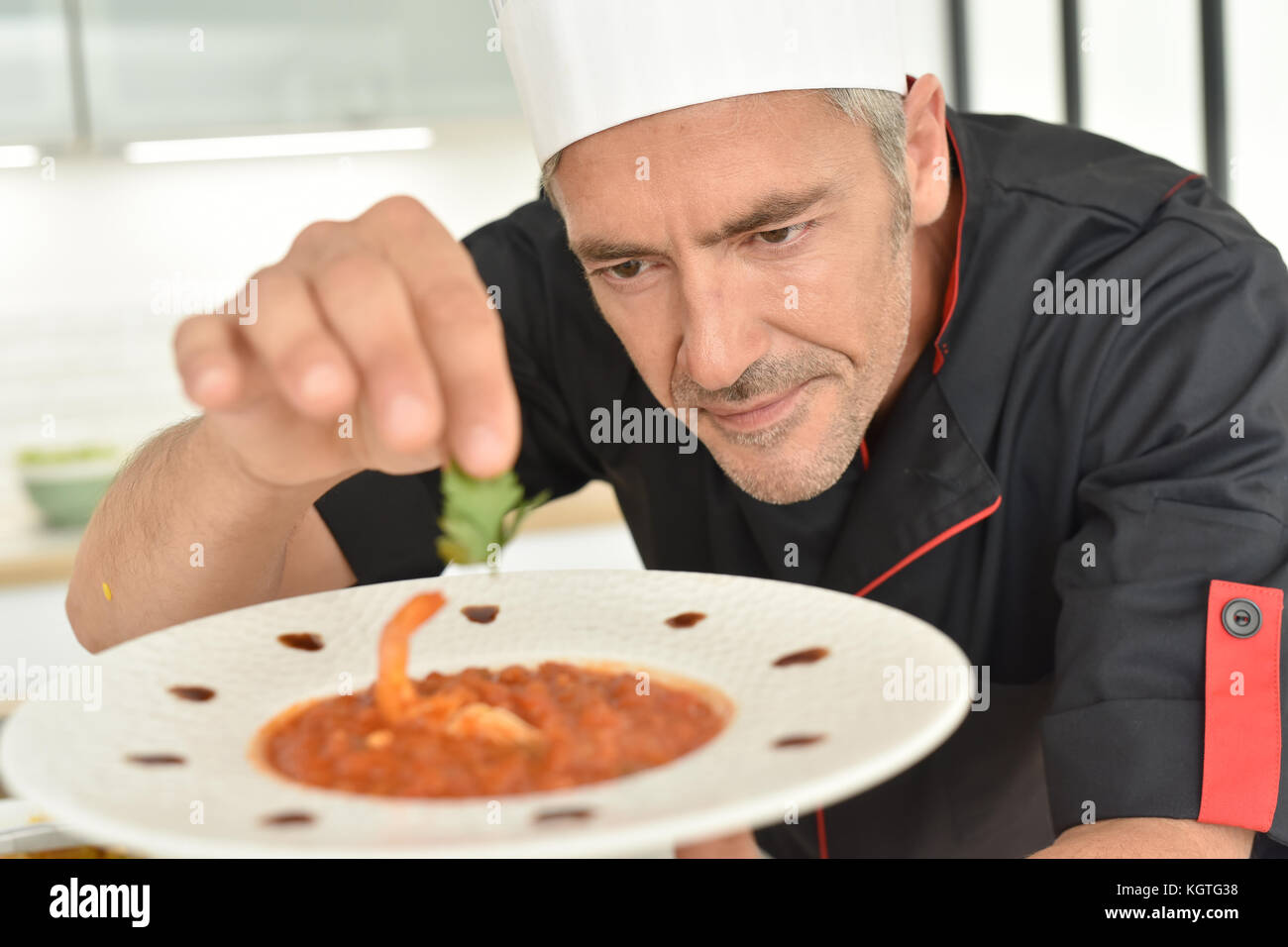 Restaurant chef presenting new dish Stock Photo - Alamy