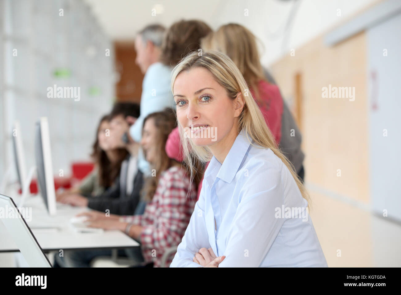 teacher working on laptop computer in classroom Stock Photo - Alamy