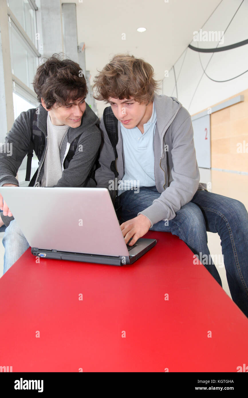 Group of teenage boys at school with laptop computer Stock Photo - Alamy