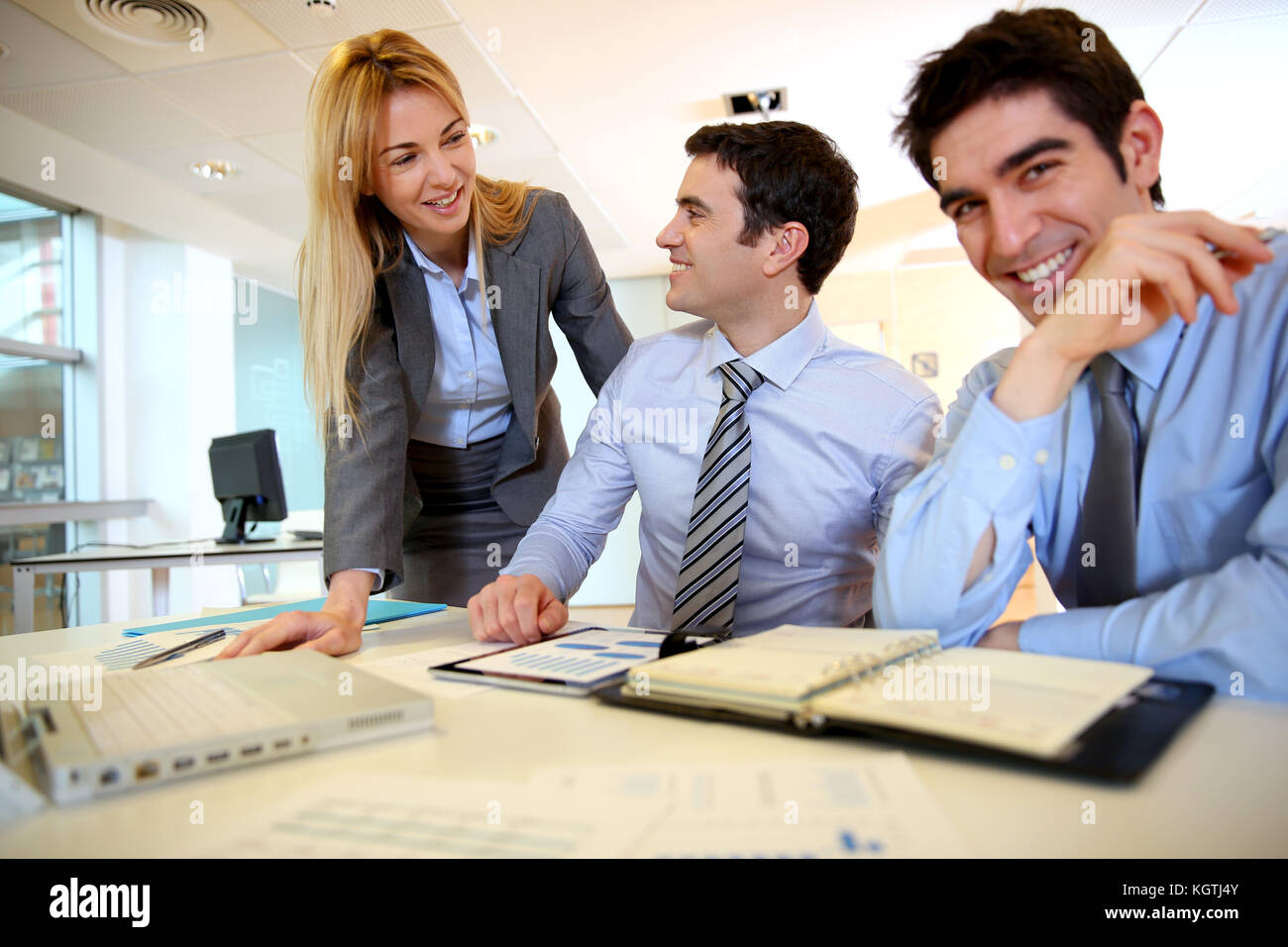 Business team working on sales results Stock Photo - Alamy
