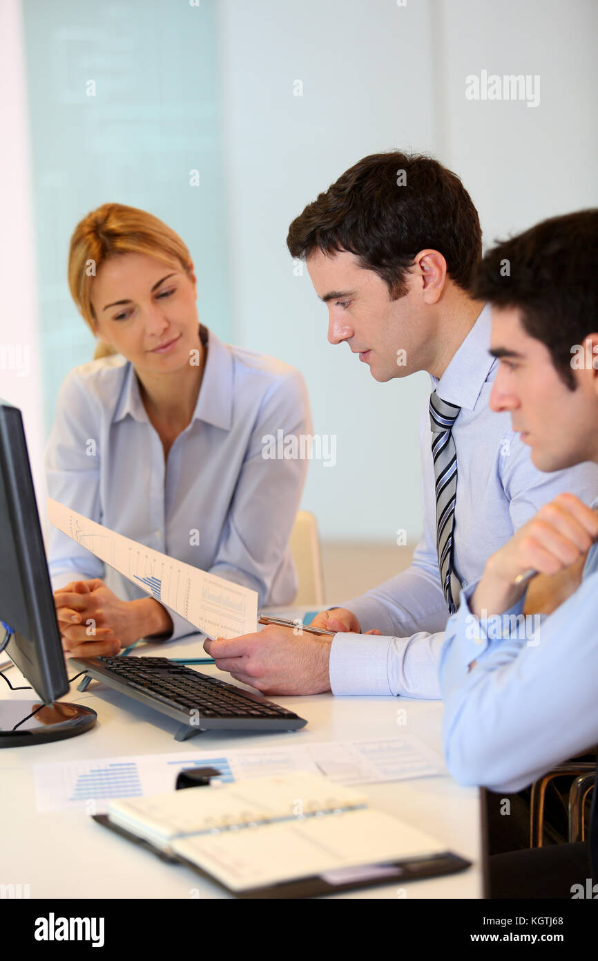 Business team working in front of desktop Stock Photo - Alamy