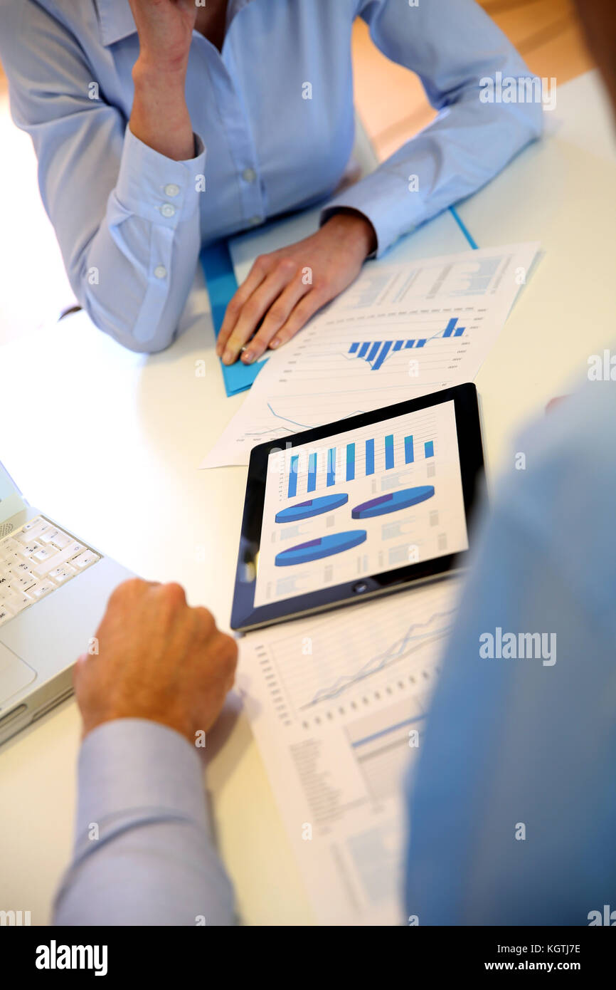 Closeup of tablet screen presenting charts Stock Photo - Alamy