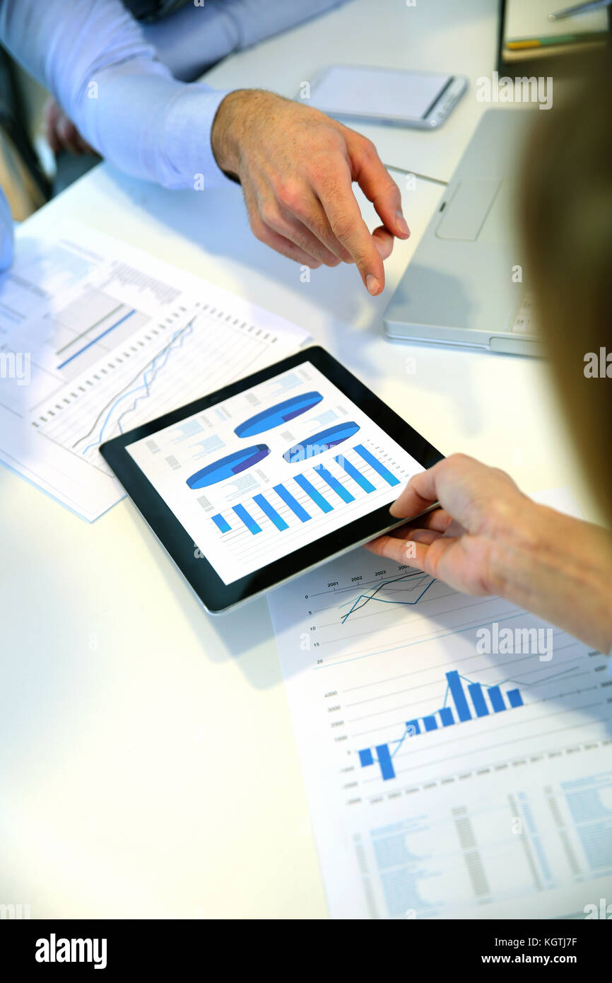 Closeup of tablet screen presenting charts Stock Photo - Alamy