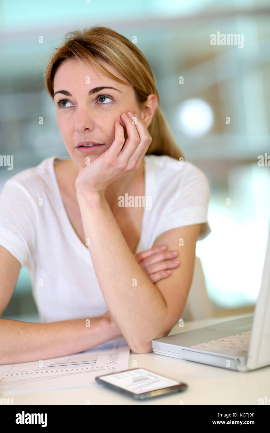 Office-worker with thoughtful look Stock Photo - Alamy