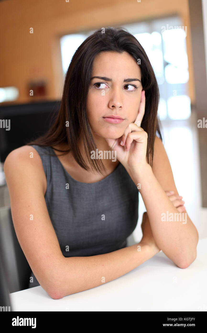Office worker with upset look on her face Stock Photo - Alamy