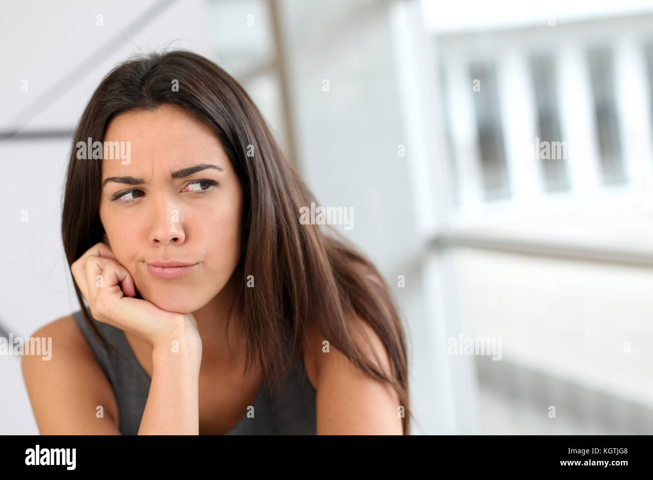 Portrait of girl with doubtful look on her face Stock Photo - Alamy