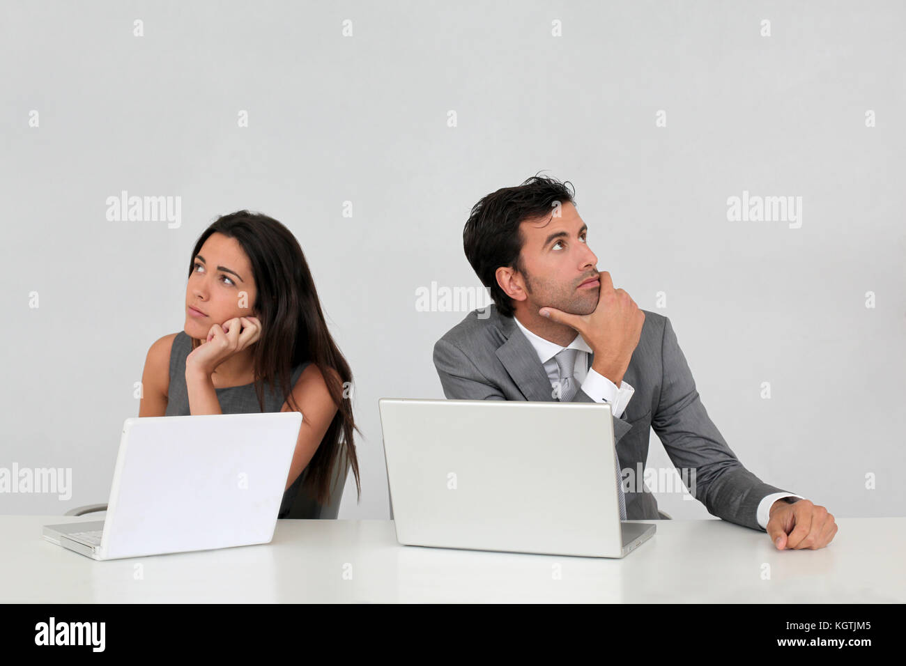 Business team with puzzled look Stock Photo - Alamy
