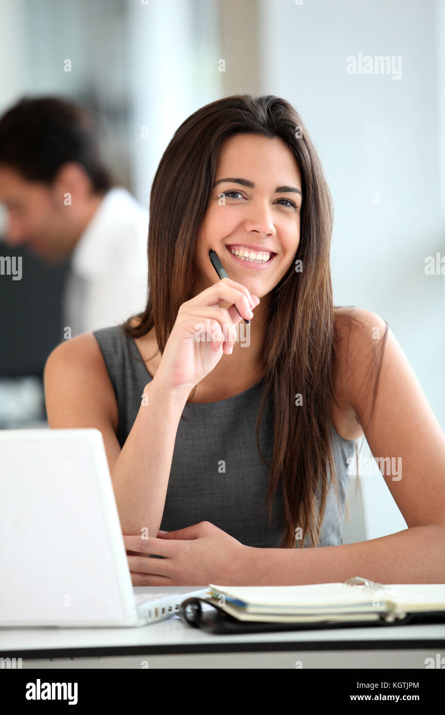 Young woman working in office Stock Photo - Alamy