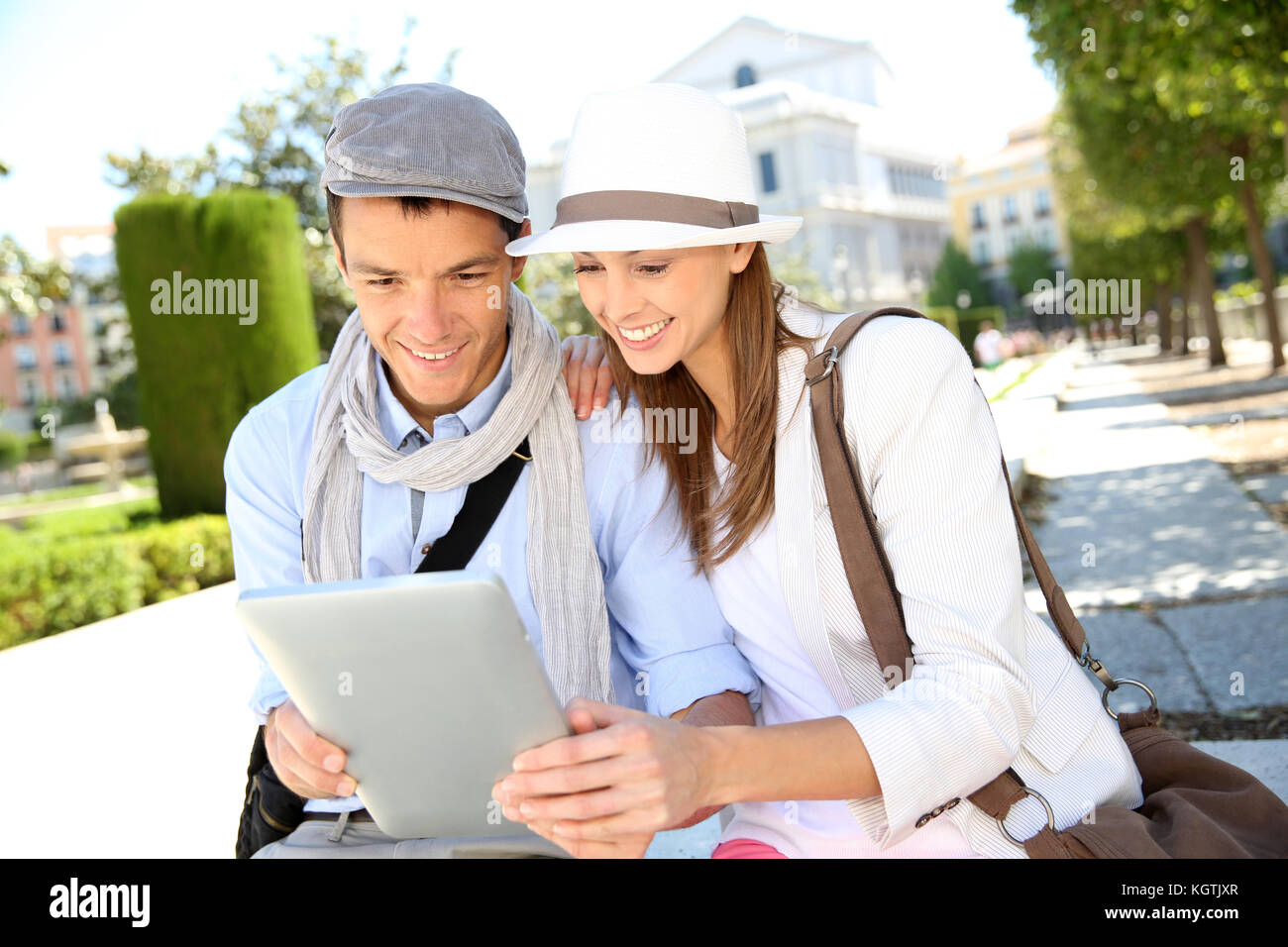 Tourists in Plaza de Oriente looking for information Stock Photo - Alamy
