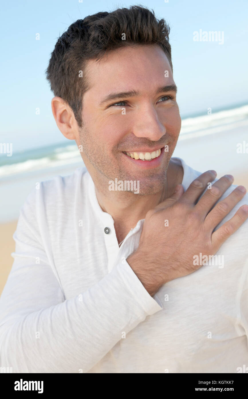 Portrait of handsome man at the beach Stock Photo - Alamy