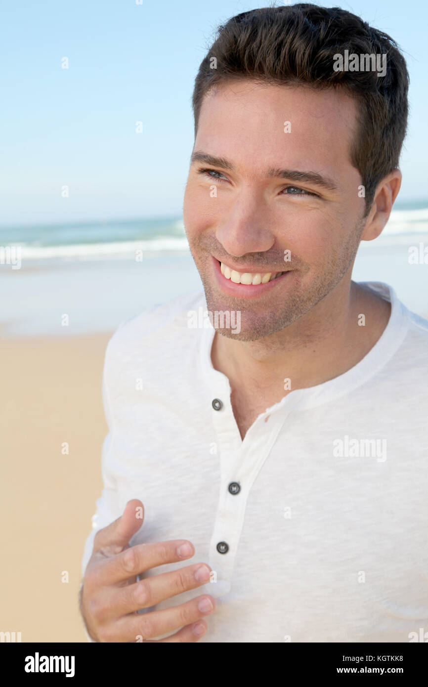 Portrait of handsome man at the beach Stock Photo - Alamy