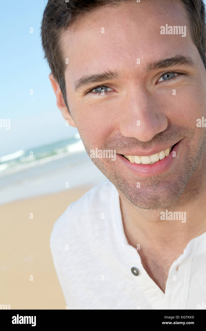 Portrait of handsome man at the beach Stock Photo - Alamy