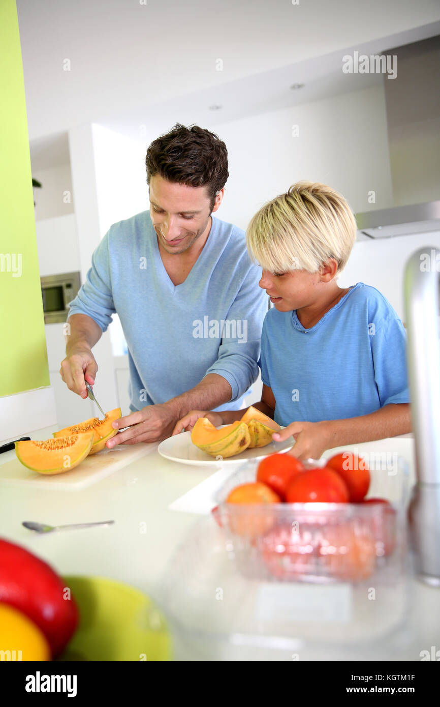 Son helping father cook hi-res stock photography and images - Alamy