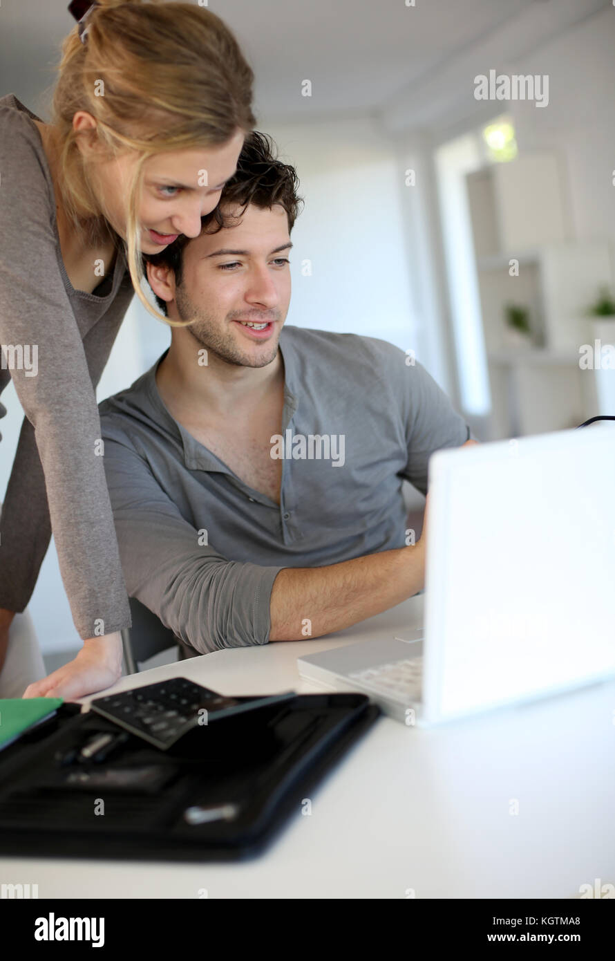 Young people studying from home with laptop computer Stock Photo - Alamy