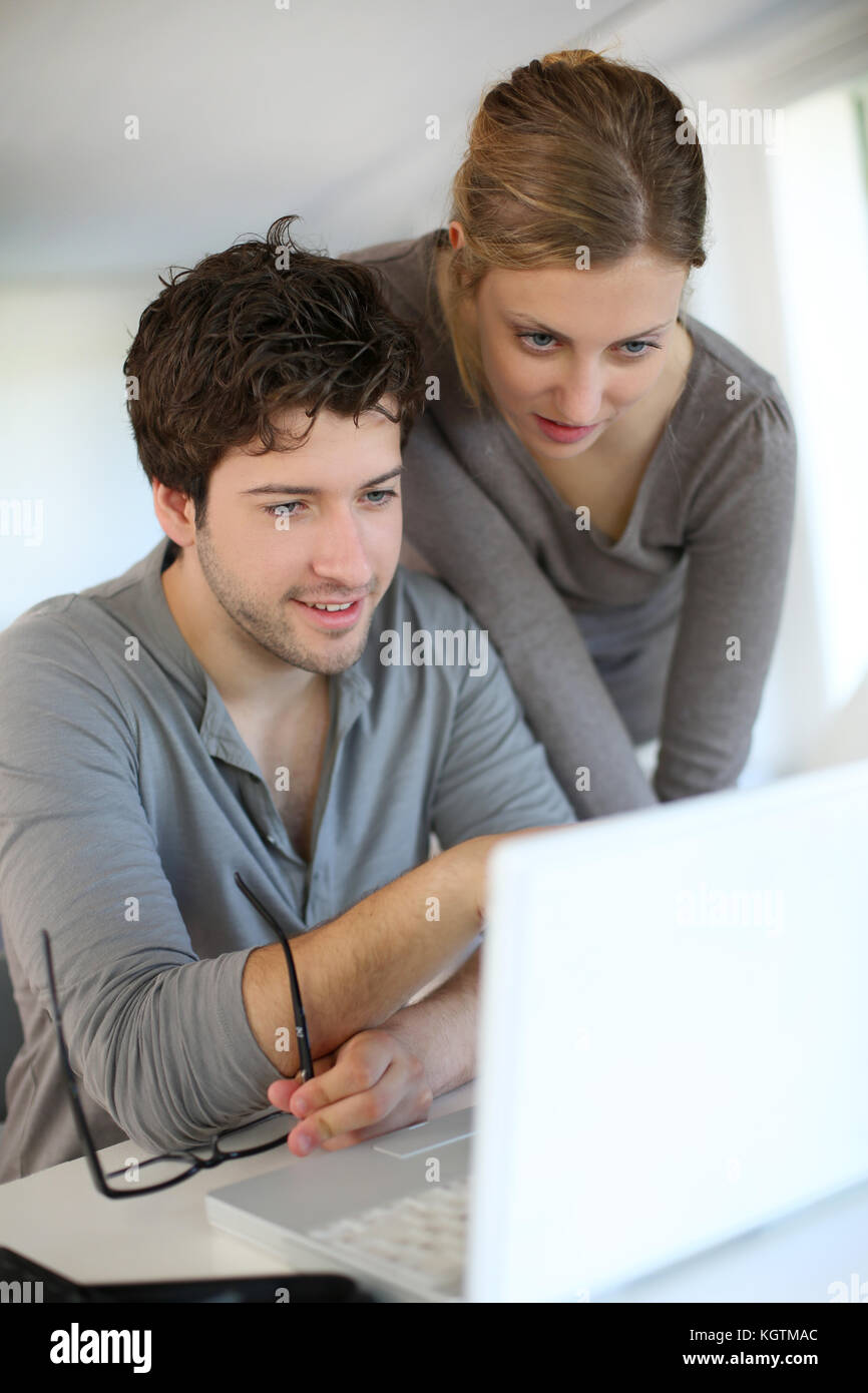 Young people studying from home with laptop computer Stock Photo - Alamy