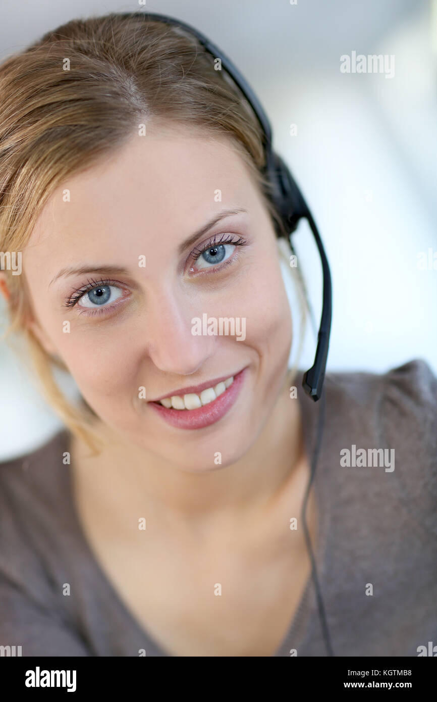 Closeup of beautiful blond teleoperator Stock Photo - Alamy