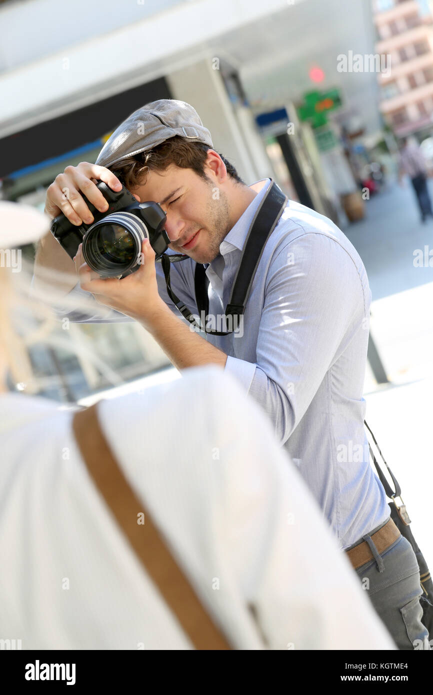 Photographer taking picture of woman model Stock Photo - Alamy