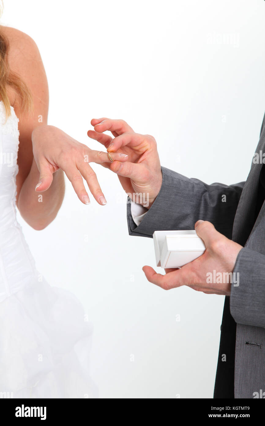 Closeup of bride and groom exchanging wedding rings Stock Photo - Alamy