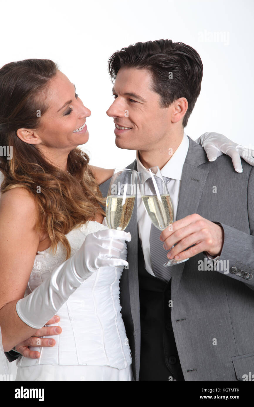 Bride and groom drinking champagne Stock Photo - Alamy