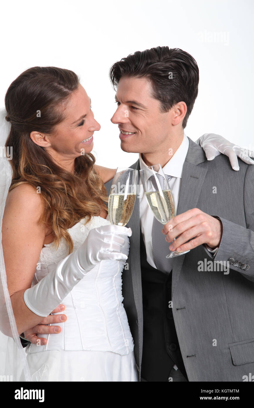 Bride and groom drinking champagne Stock Photo - Alamy
