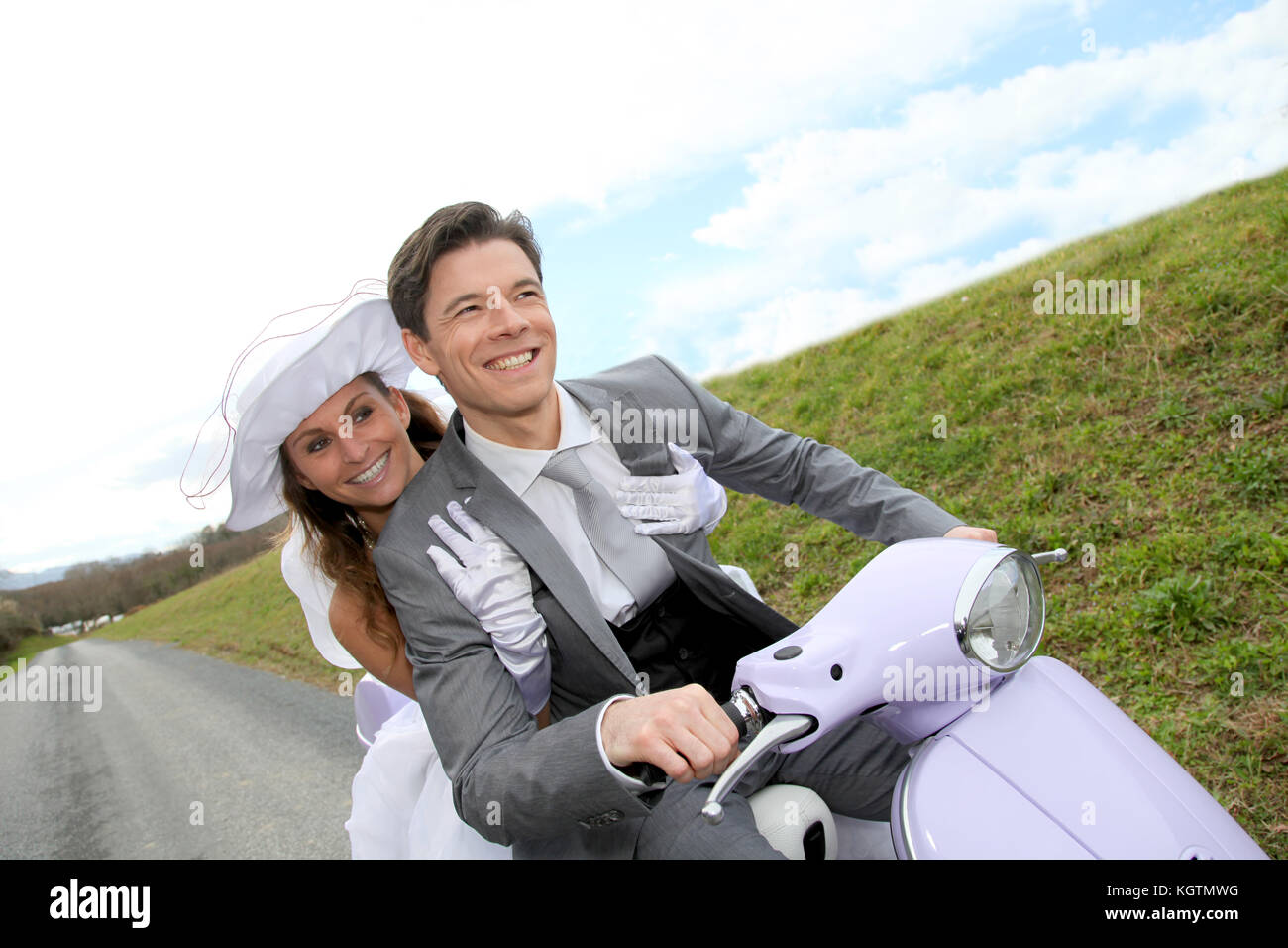 Married couple riding motorcycle on their wedding day Stock Photo - Alamy