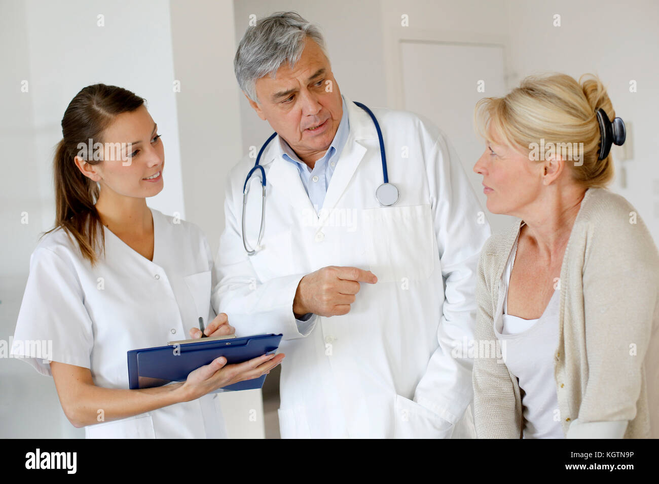Medical people giving prescription to patient Stock Photo - Alamy