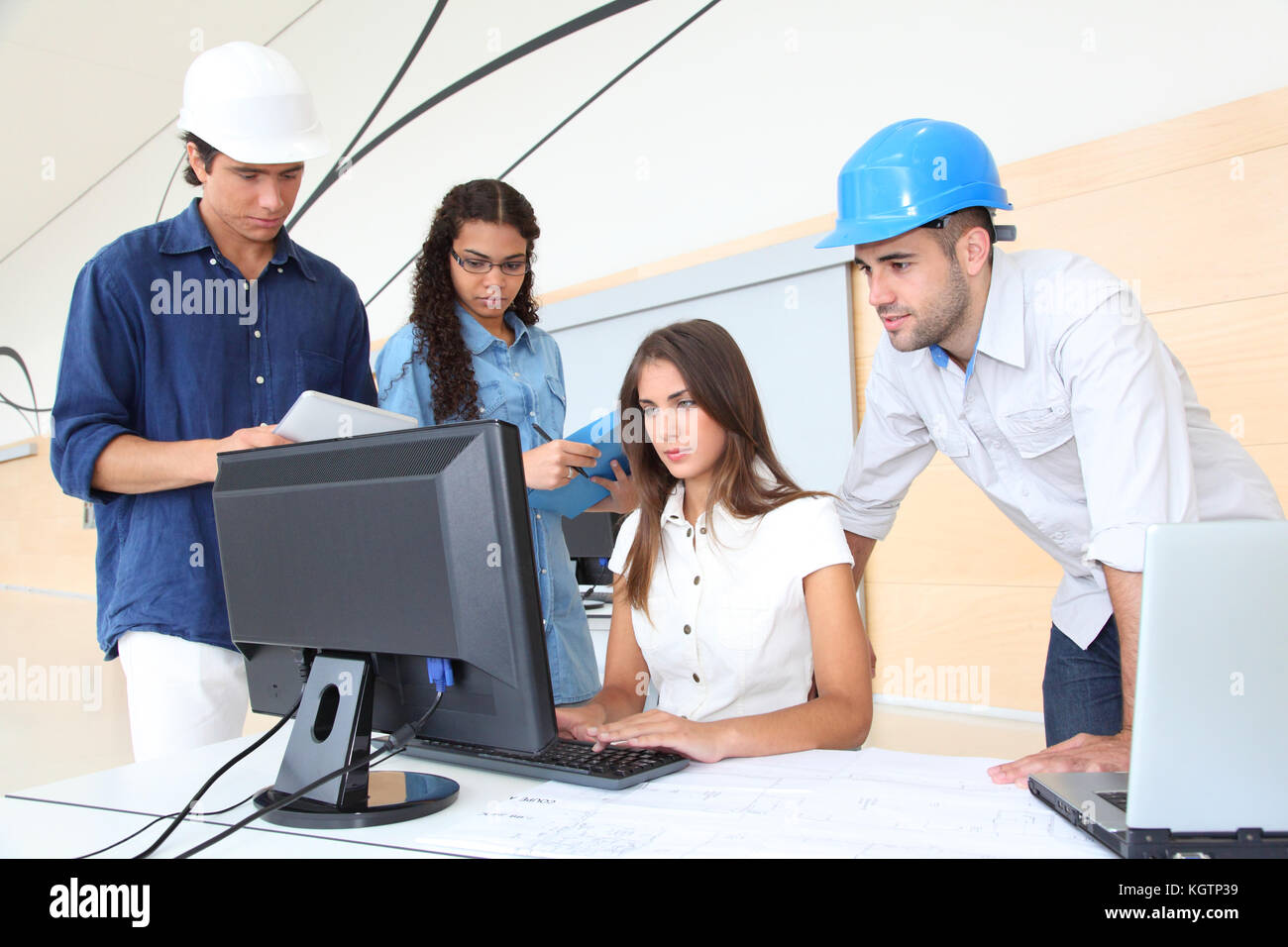 Group of young architects in business meeting Stock Photo - Alamy