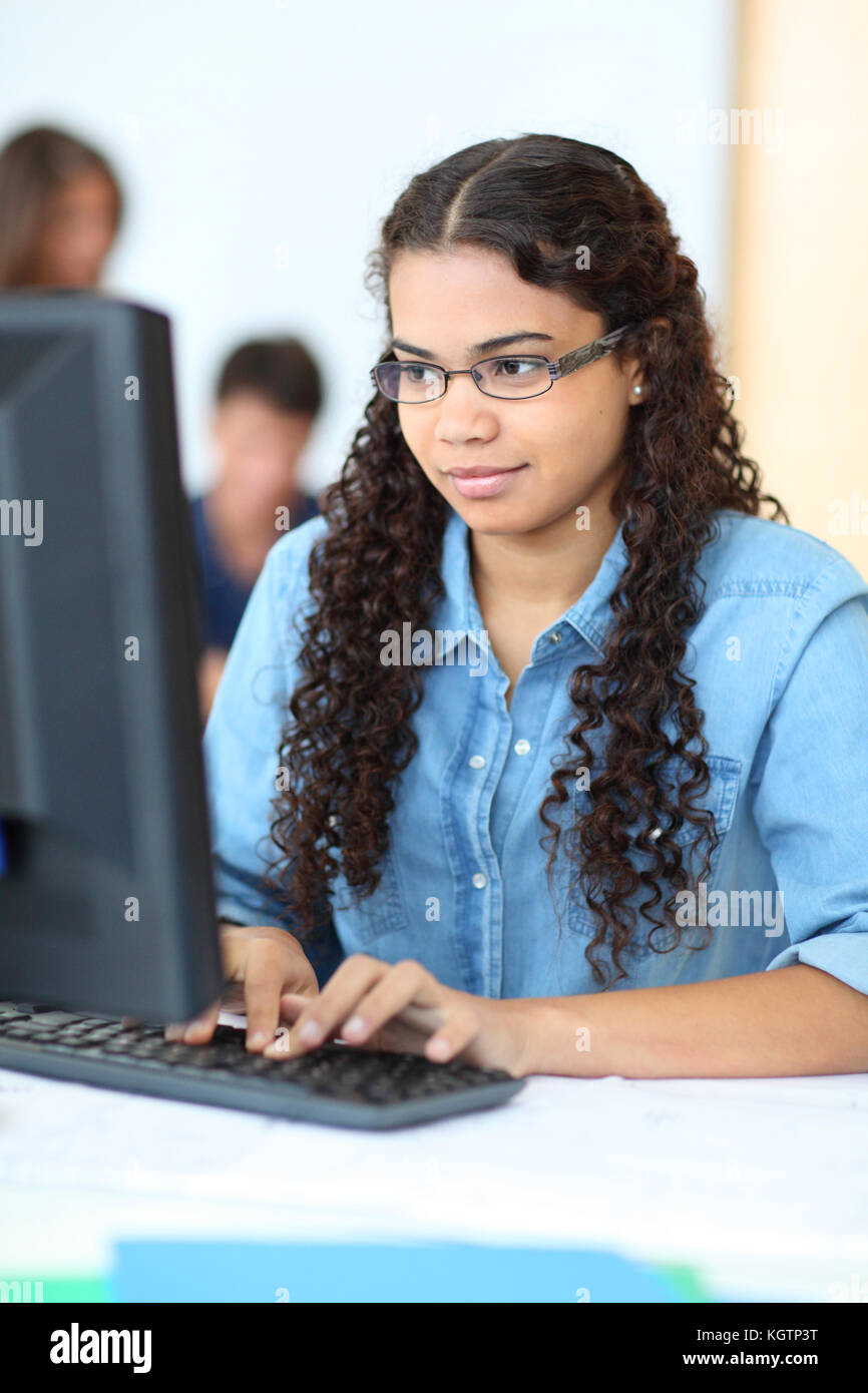 Portrait of teenager in computing class Stock Photo - Alamy