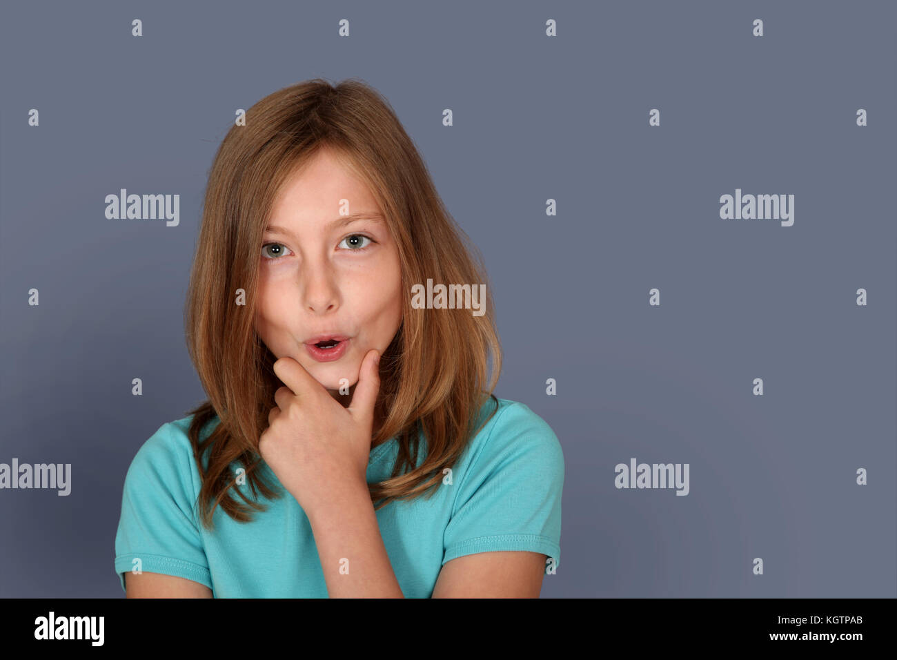 Portrait of young girl with surprised look Stock Photo - Alamy