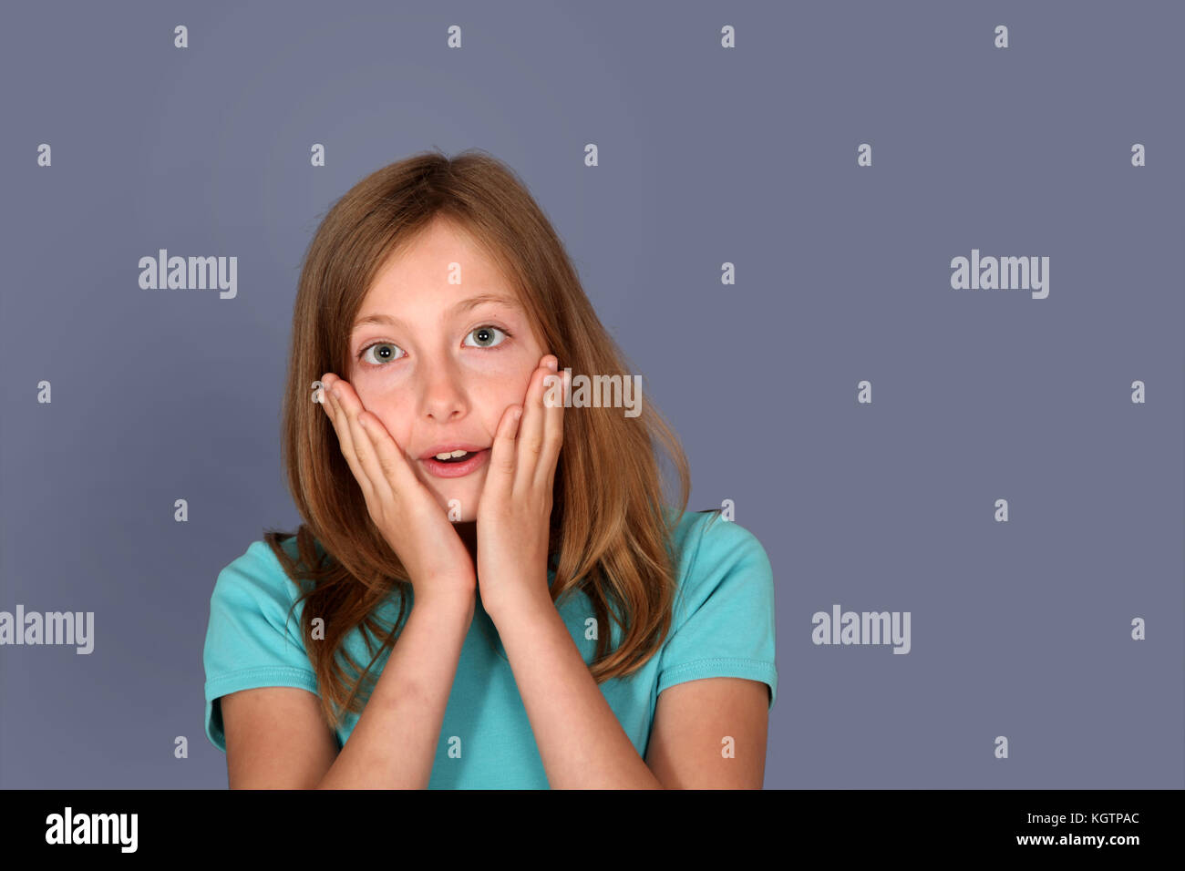 Portrait of young girl with surprised look Stock Photo - Alamy